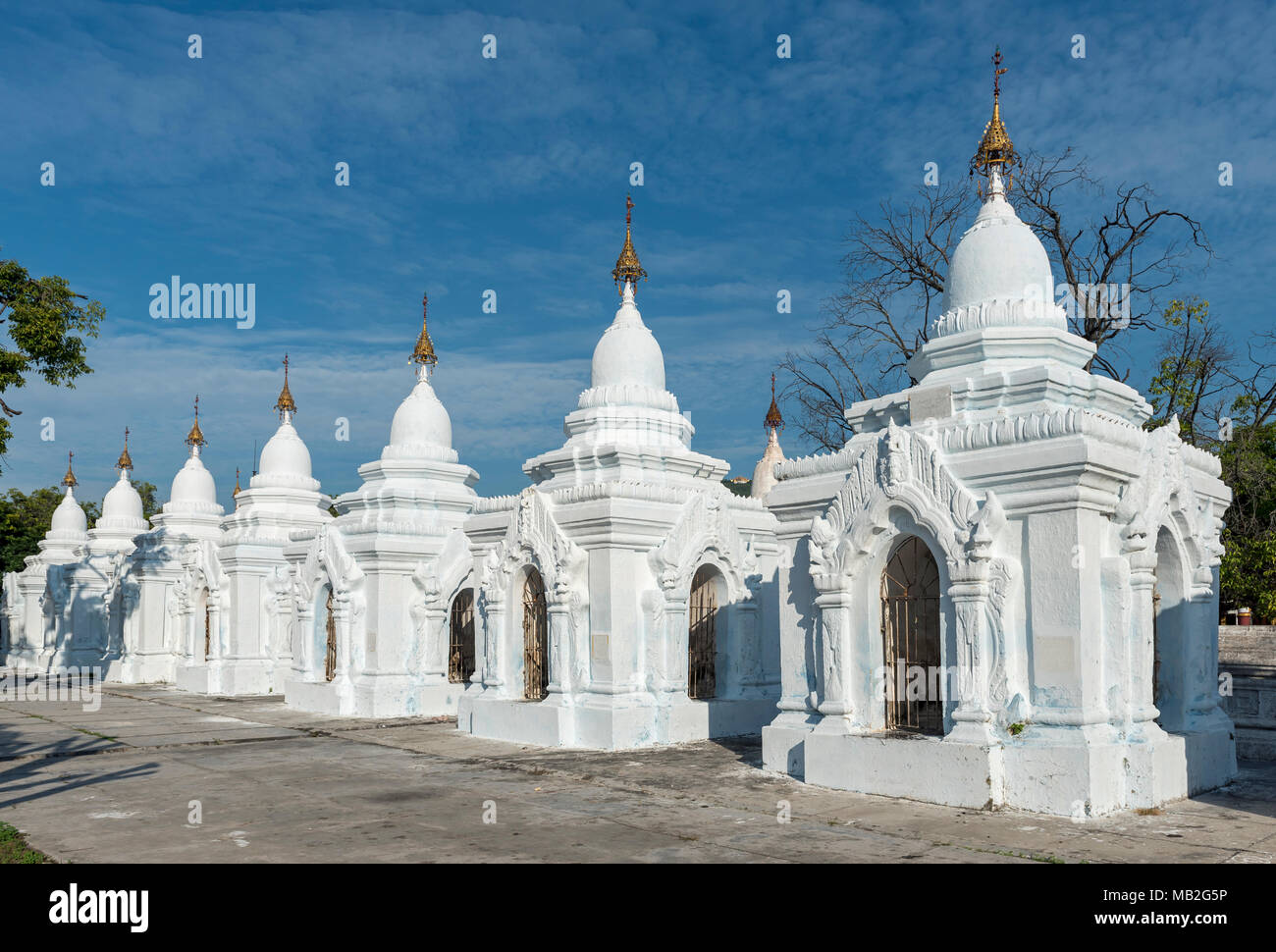 White kyauksa gu cave stupas at Kuthodaw Pagoda, Mandalay, Burma ...
