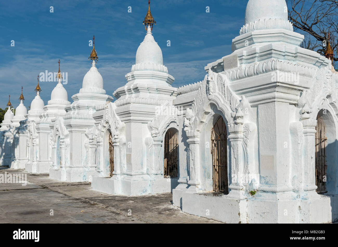 White kyauksa gu cave stupas at Kuthodaw Pagoda, Mandalay, Burma ...