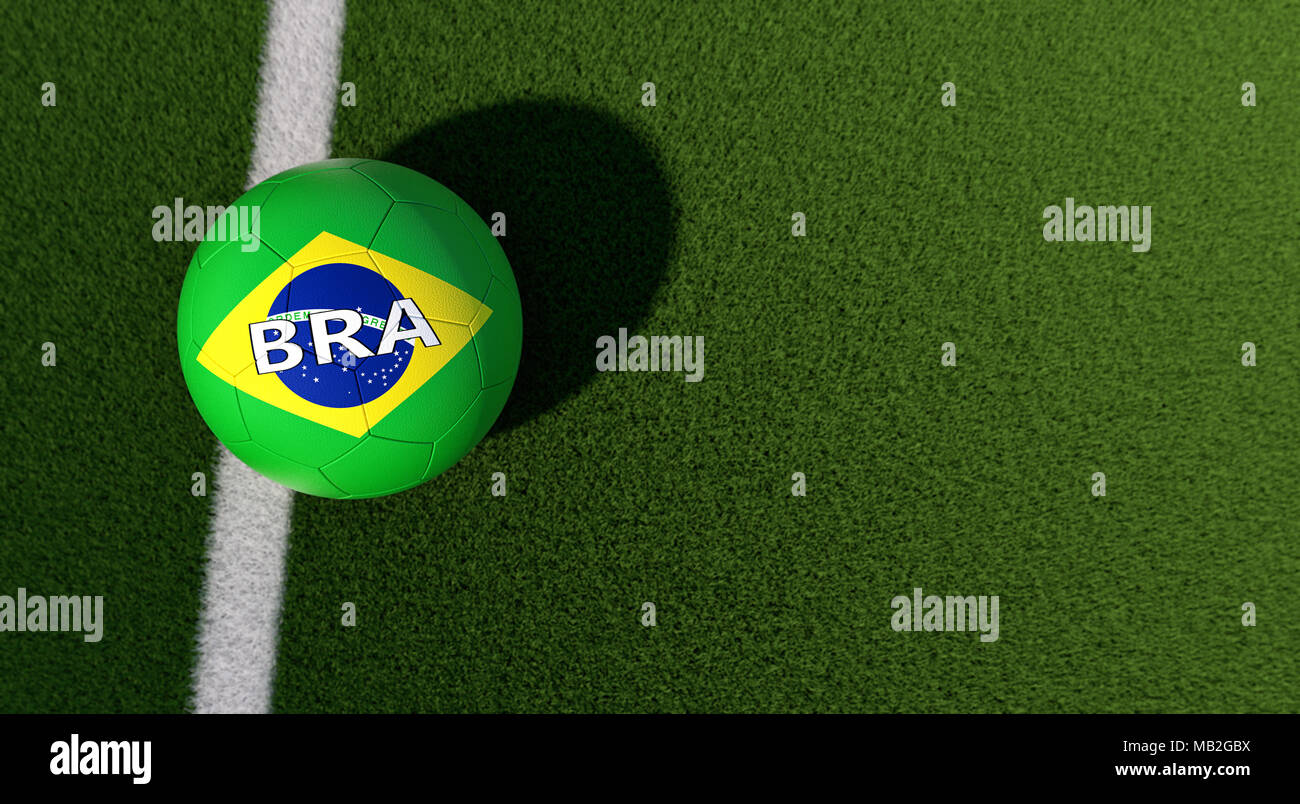 Soccer ball in brazils national colors on a soccer field. Copy space on ...