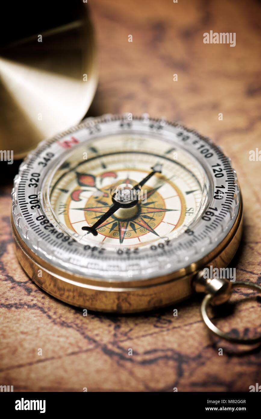 Vintage compass and old navigation map Stock Photo - Alamy