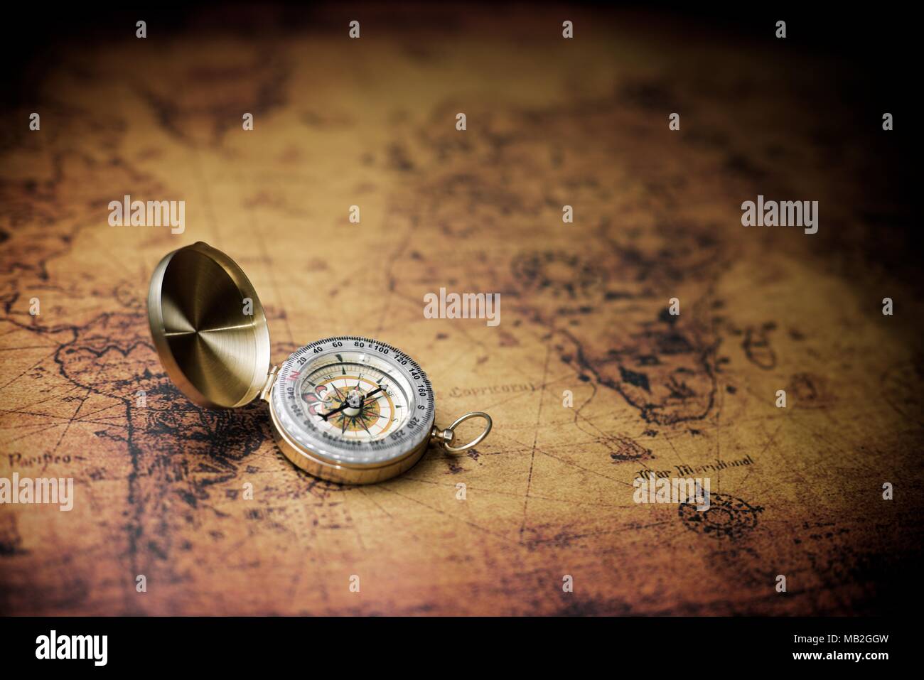 Vintage compass and old navigation map Stock Photo - Alamy