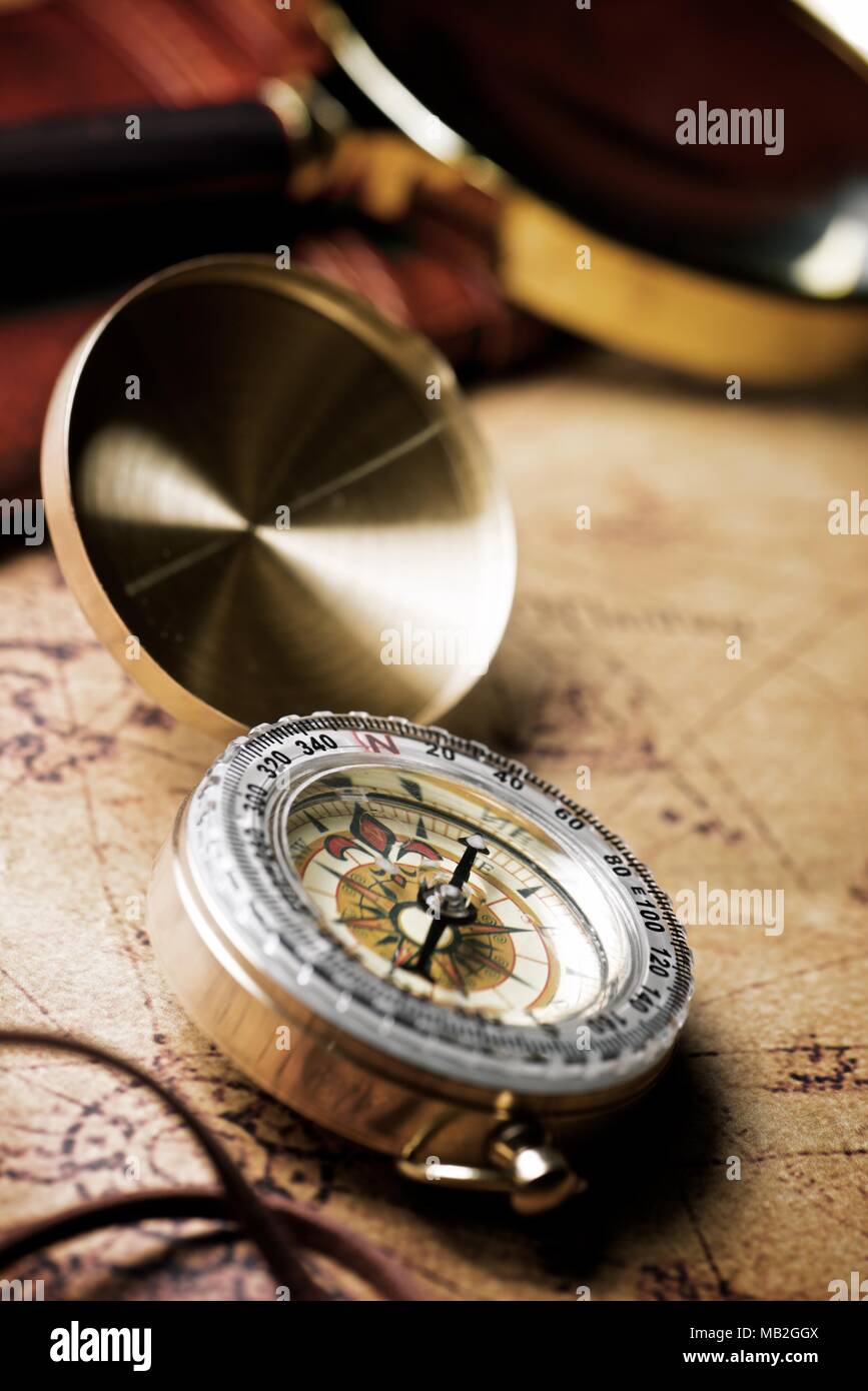 Vintage compass and old navigation map Stock Photo - Alamy