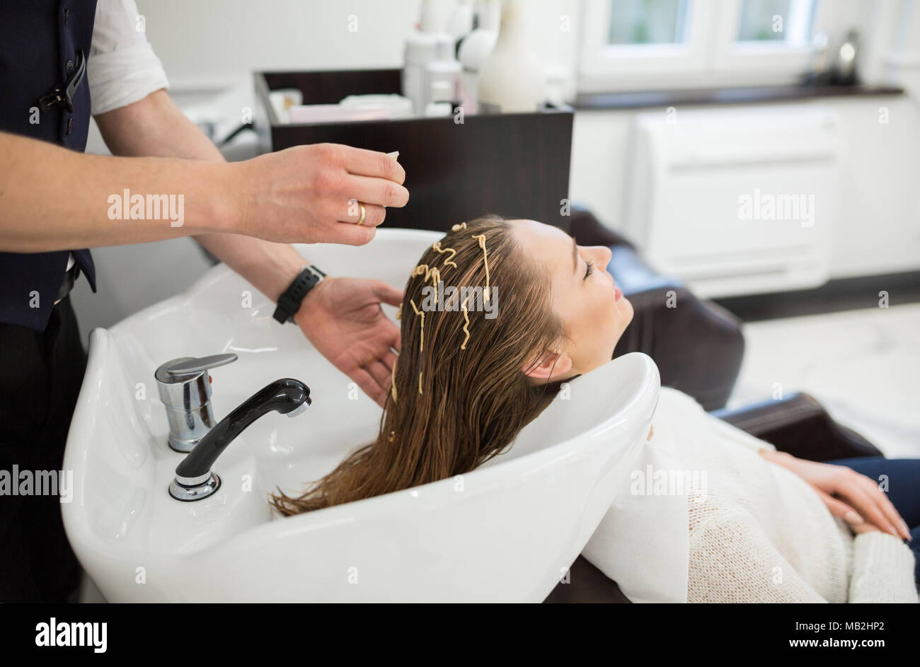 Woman applying hair conditioner hi-res stock photography and images - Alamy
