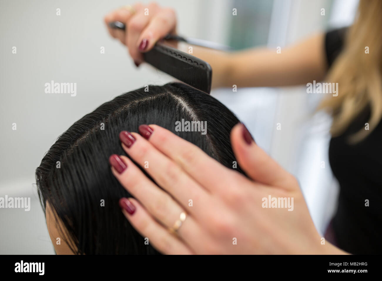 Woman combing hair fingers hi-res stock photography and images - Alamy
