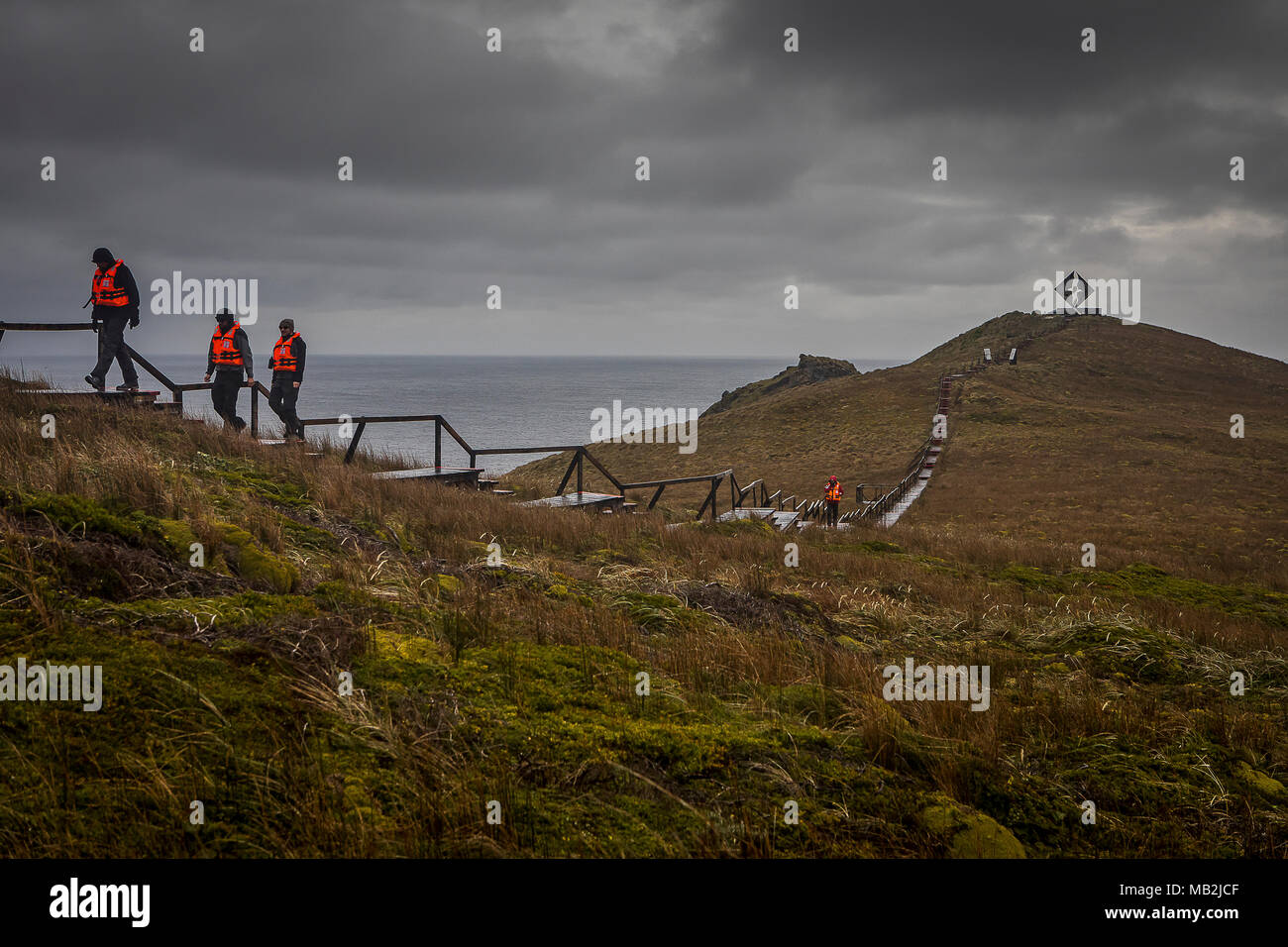 Explorers walking, in background Albatross memorial for lost mariners ...