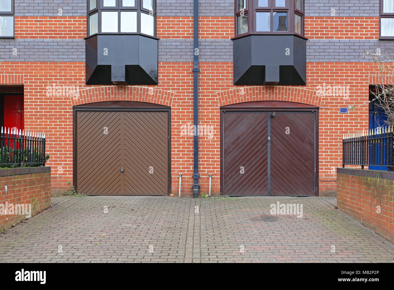 Two Garage Doors at Residential Building Stock Photo - Alamy