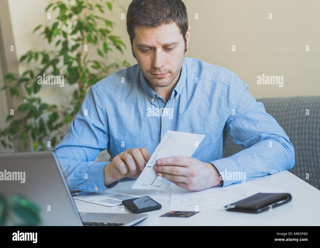 Man opening envelope hi-res stock photography and images - Alamy