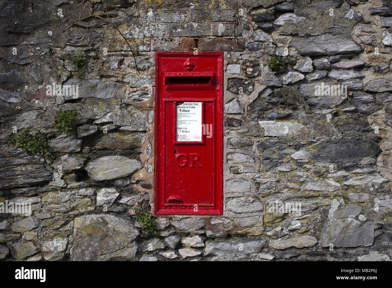 Royal Mail red post box embedded in old brick wall in UK / English ...