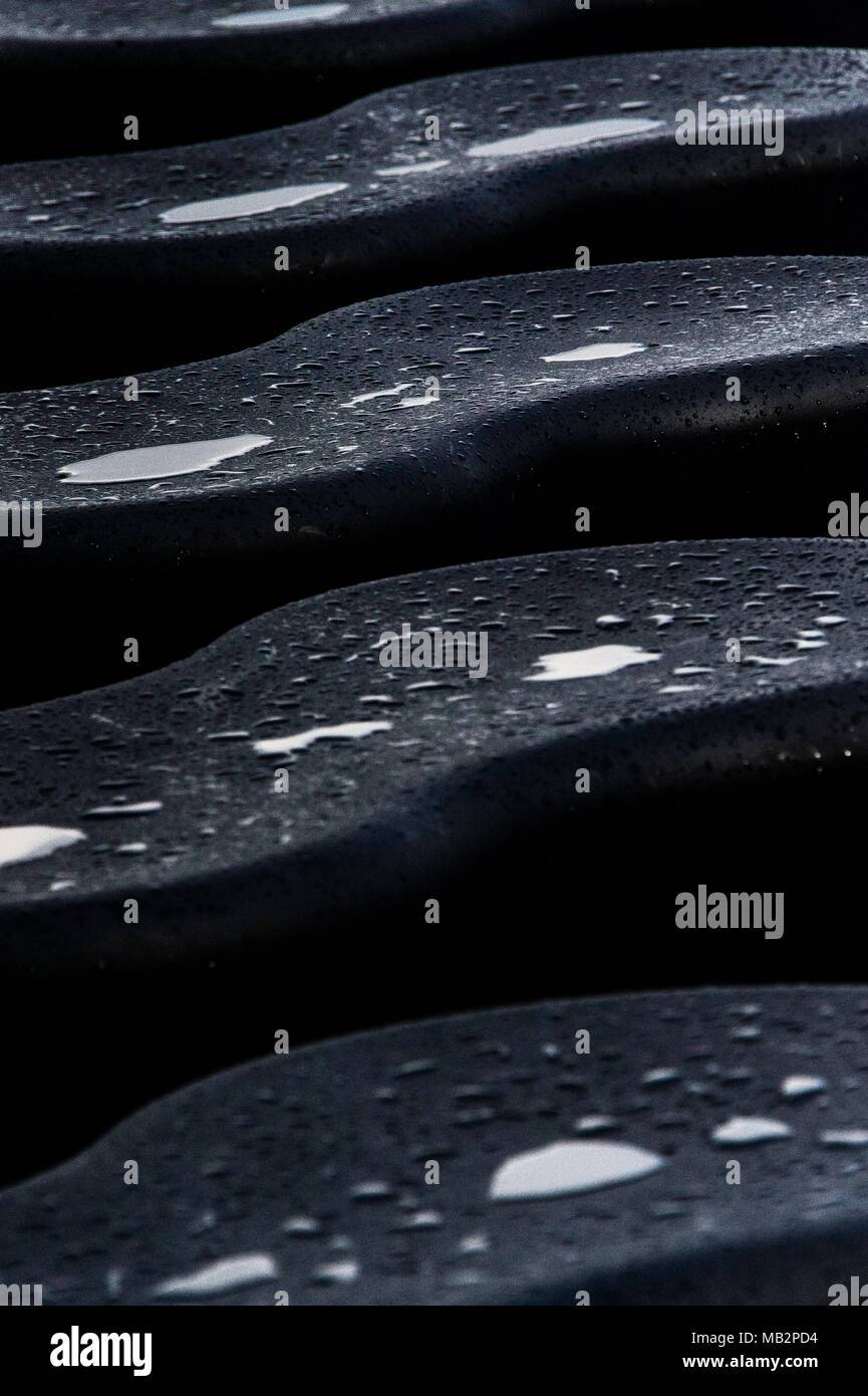Rain puddles on stools in New York City, July 2013 Stock Photo - Alamy
