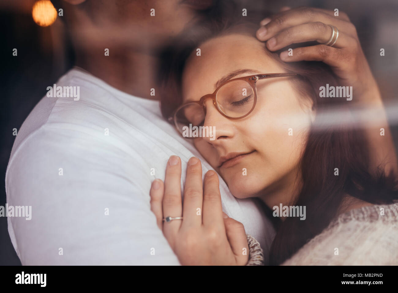 Close Up Of Couple In Love Embracing Behind Window Beautiful Woman