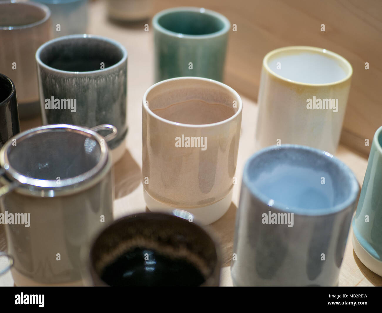 Row of japanese porcelain cups on display in store Stock Photo - Alamy