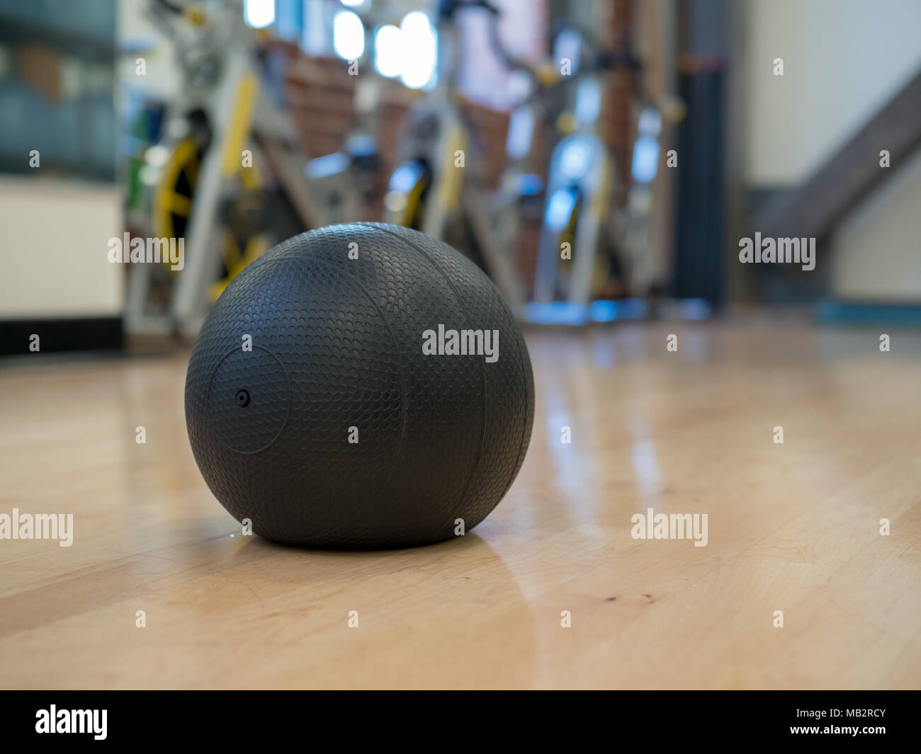 Medicine ball in an exercise studio with equpiment and bikes in ...