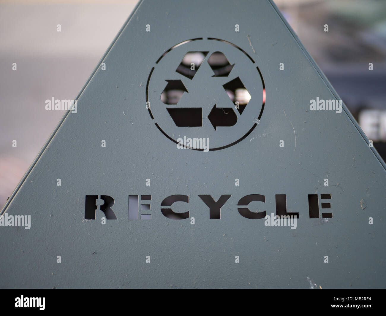 Recycle logo on an outdoors trash can on a sunny day Stock Photo - Alamy