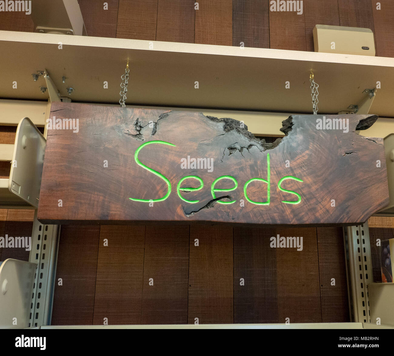Rustic "seeds" sign on top of library shelf Stock Photo - Alamy