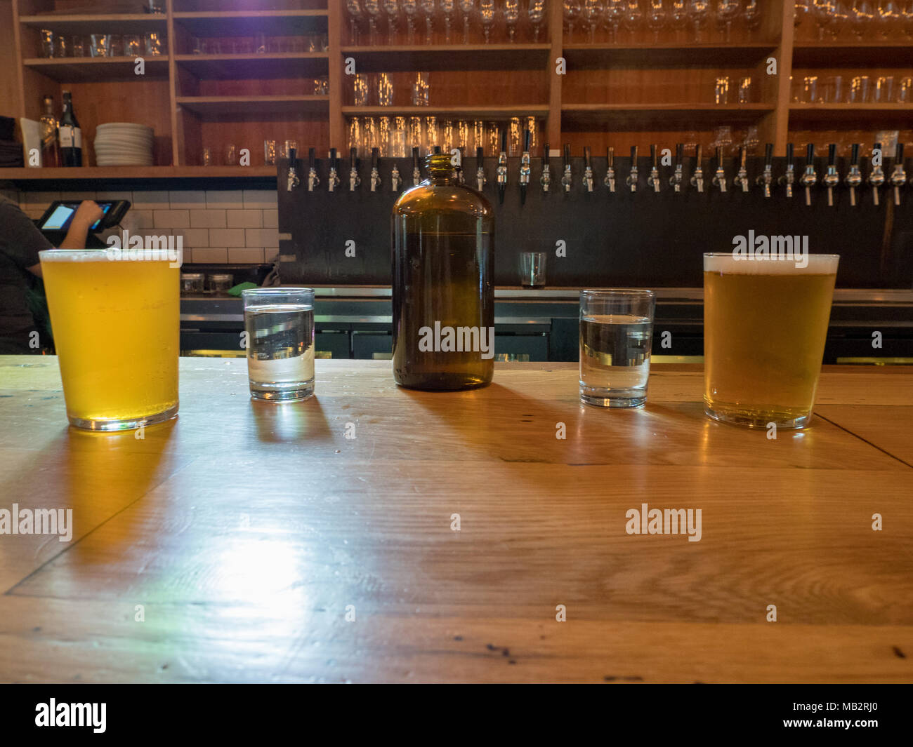 Water jug, cups, and beer on bar counter in brewery Stock Photo - Alamy