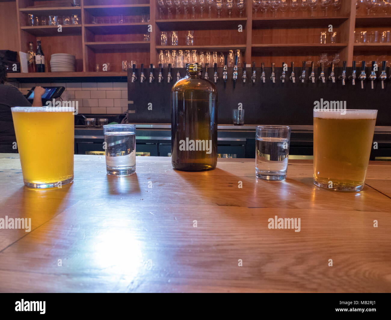 Water jug, cups, and beer on bar counter in brewery Stock Photo - Alamy