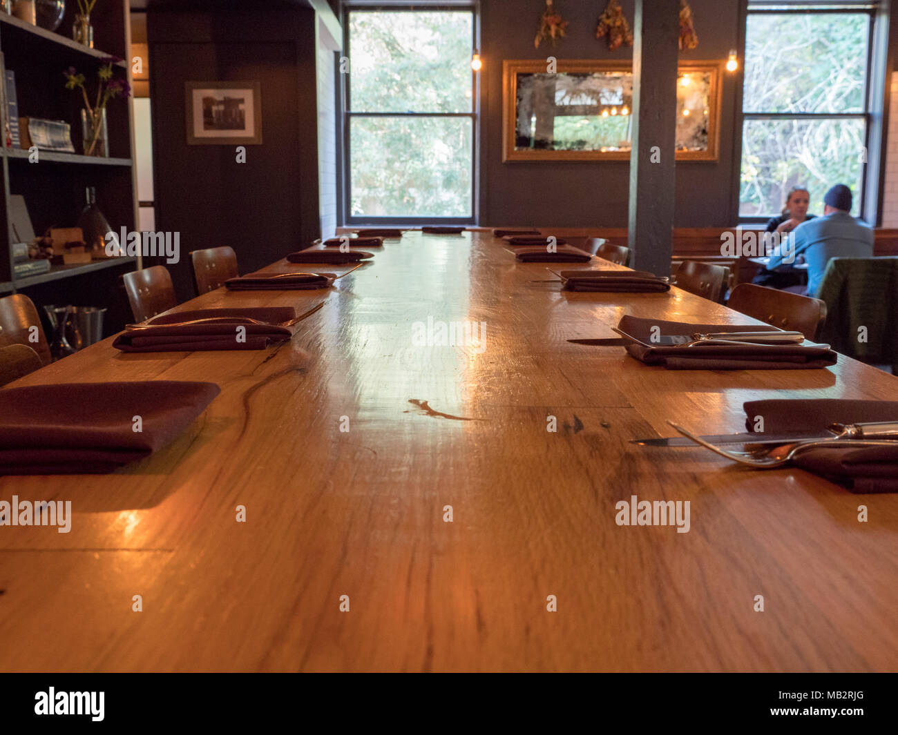 Long table prepared to serve in a brewery Stock Photo - Alamy