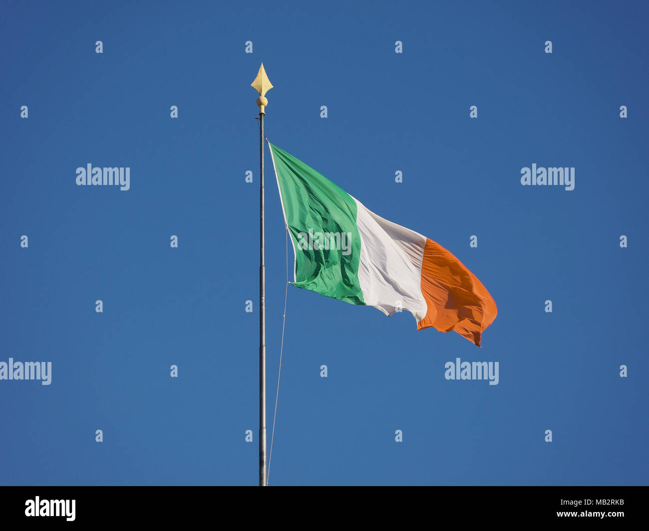 the Irish national flag of Ireland, Europe over blue sky Stock Photo ...