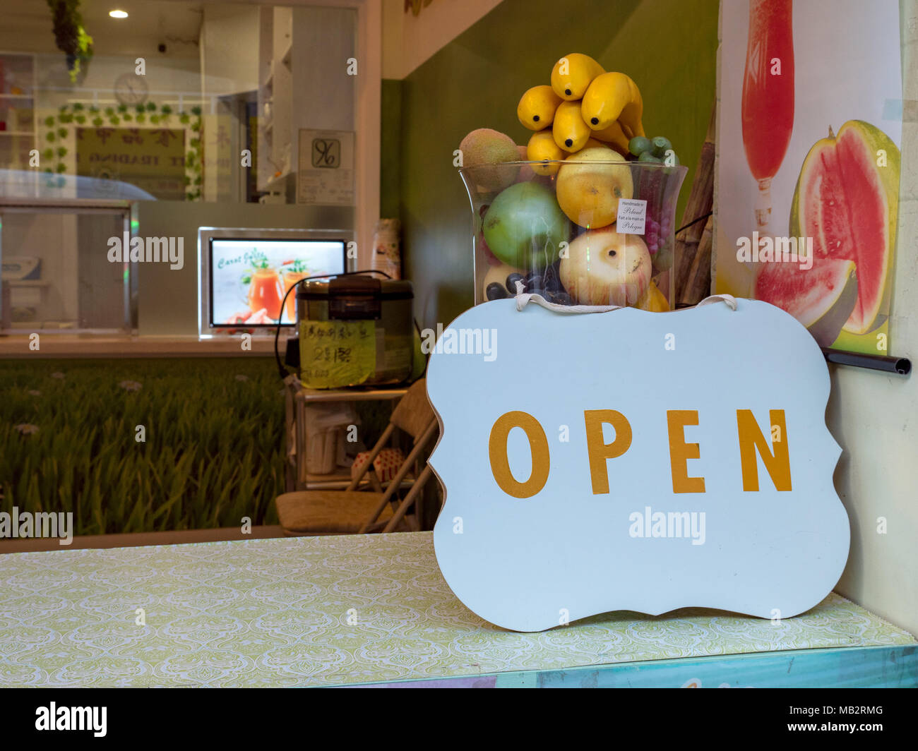 Open sign on top of shop counter Stock Photo - Alamy