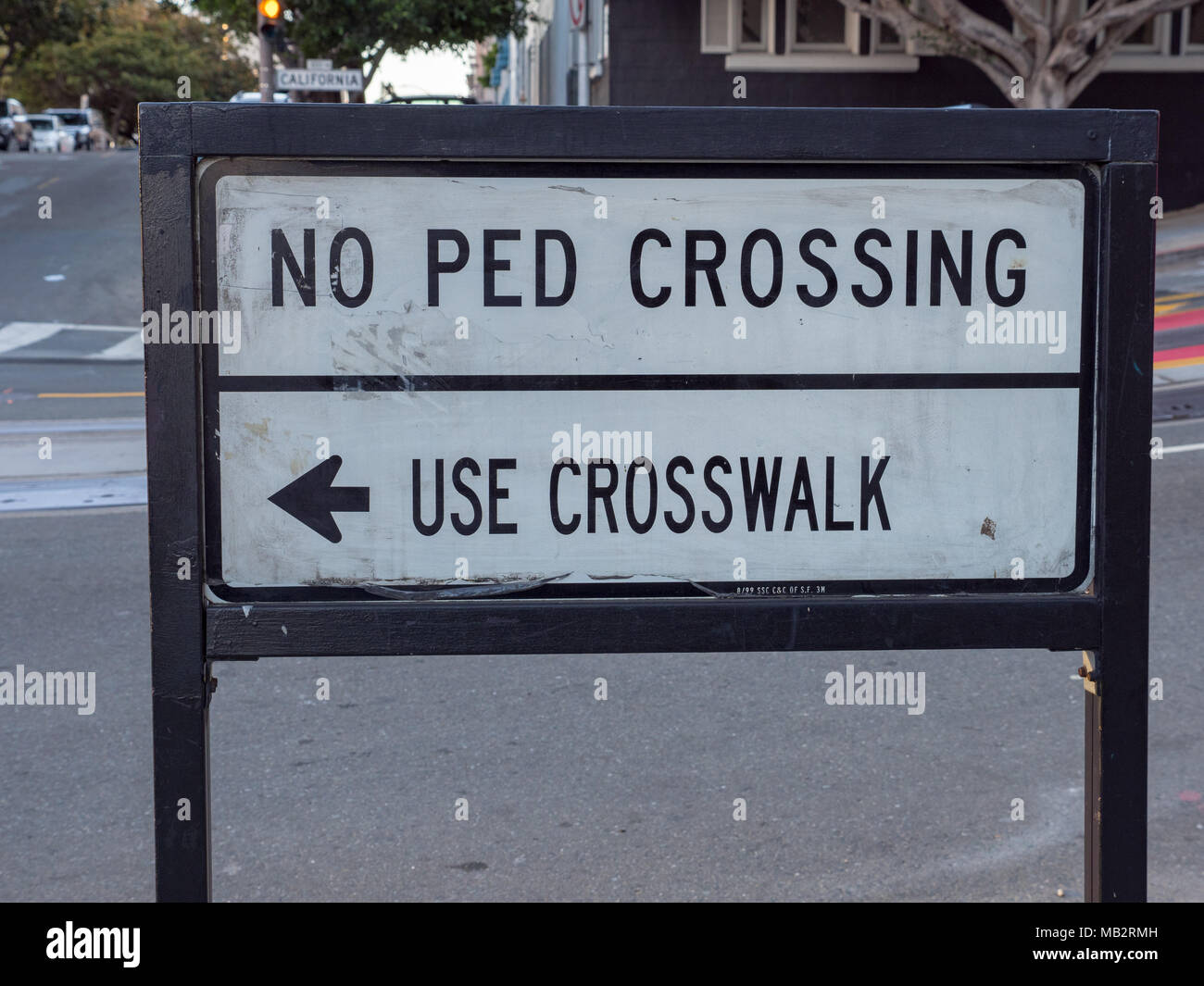 Pedestrian crosswalk sign in city Stock Photo - Alamy