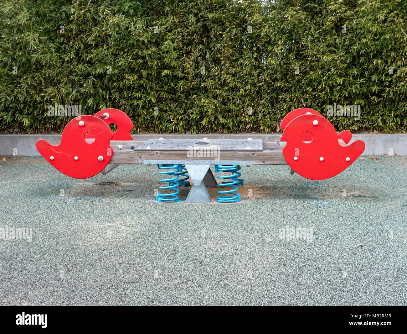 Birds see saw in playground Stock Photo - Alamy