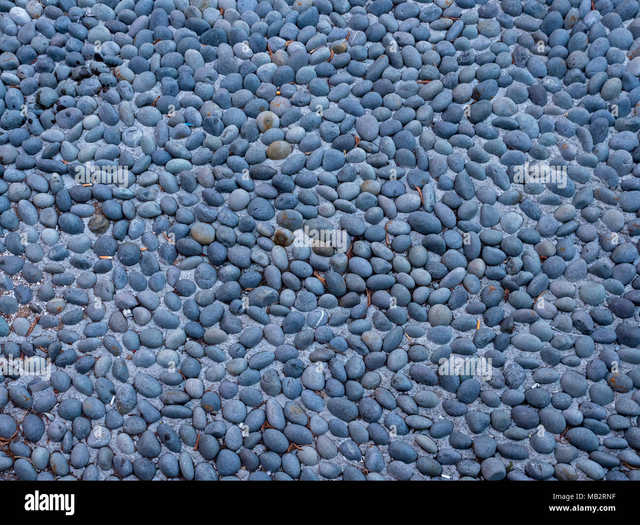 Pebble pattern on ground Stock Photo - Alamy