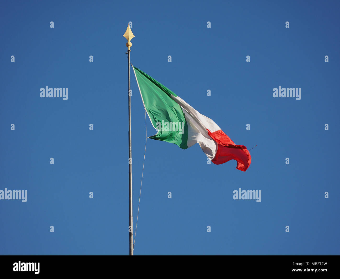 the Italian national flag of Italy, Europe over blue sky Stock Photo ...