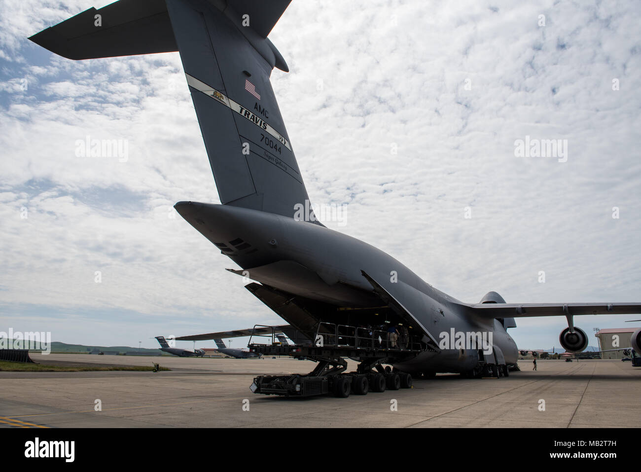 Airmen with the 60th Aerial Port Squadron along with members of the ...