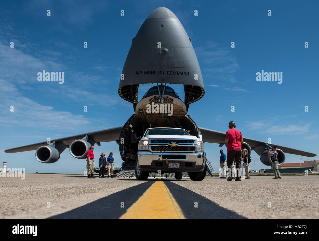 Ramon Duenas, 60th Aerial Port Squadron, demonstrates to personnel from ...