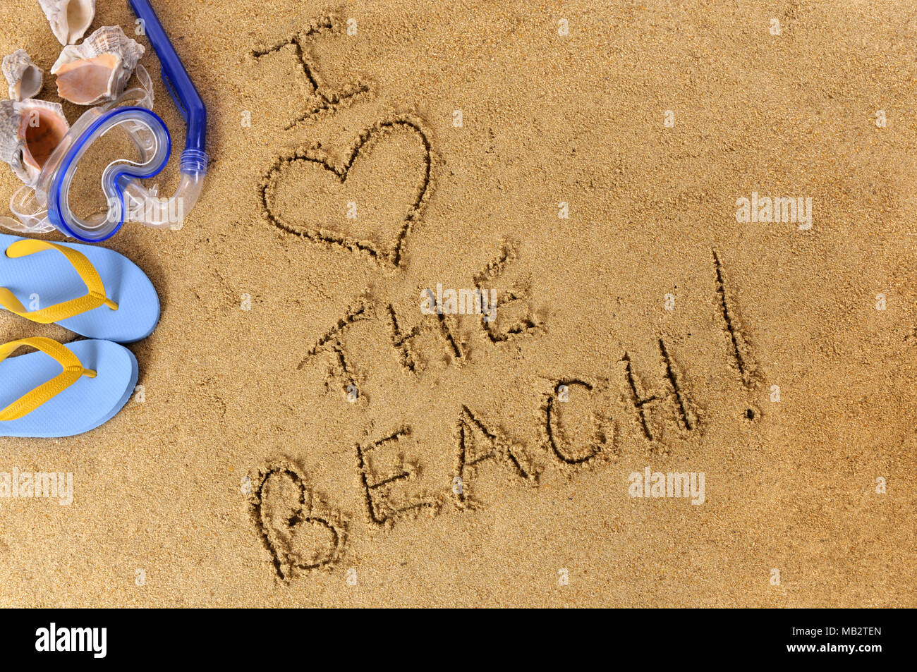 Beach writing with scuba mask, seashells and flip flops Stock Photo - Alamy