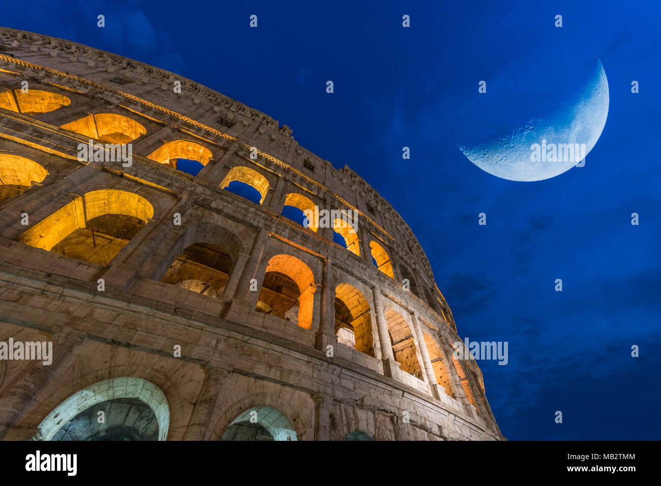 Moon over Coliseum Stock Photo - Alamy