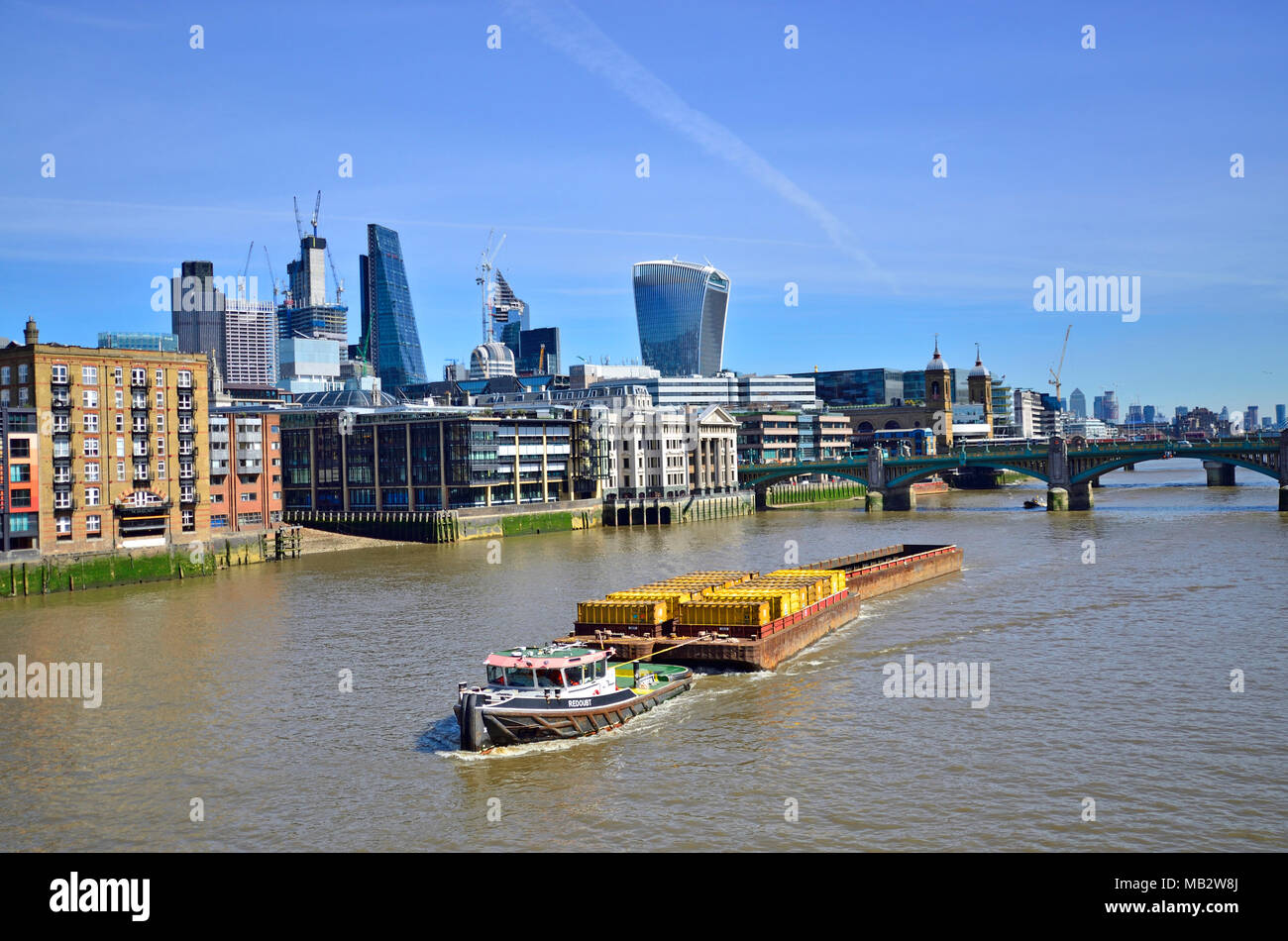 London, England, UK. Thames barge Redoubt towing cargo down the river ...