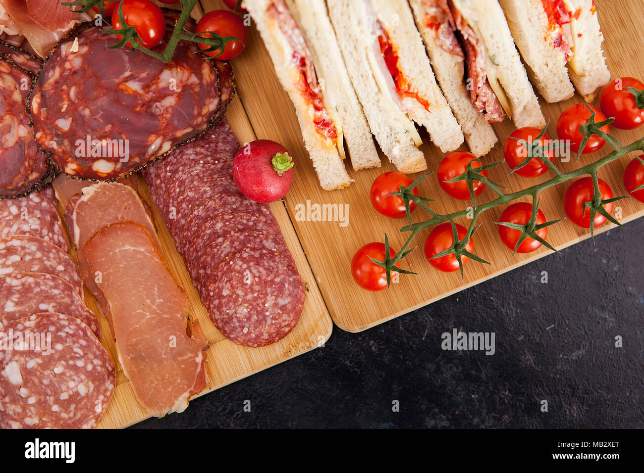 Delicious club sandwiches next to appetizers Stock Photo - Alamy