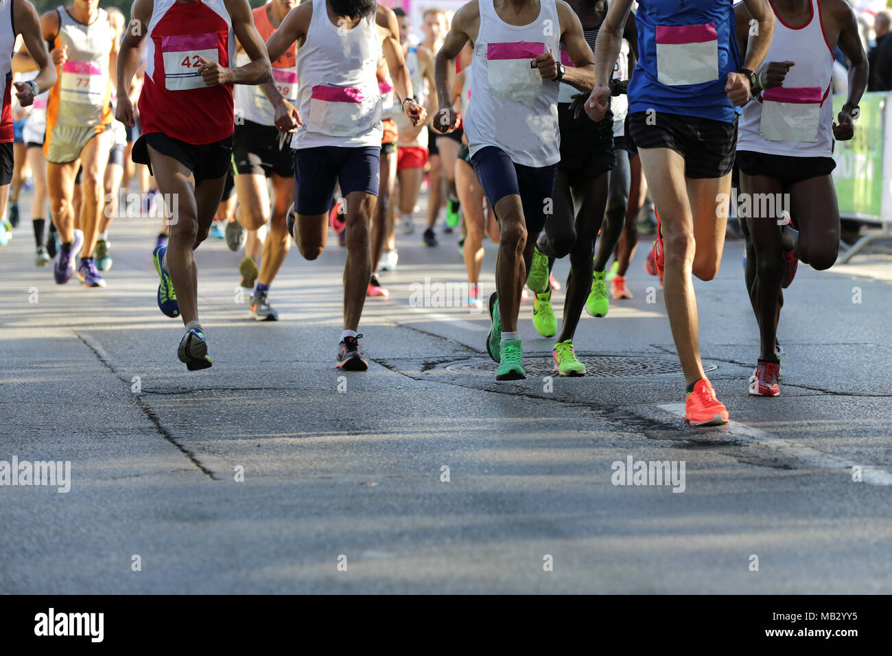 Marathon running race. Legs and bodies only. Unrecognizable people. The ...