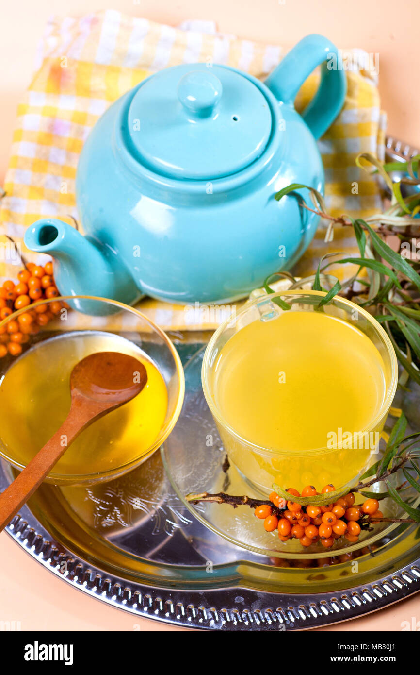 Sea buckthorn tea with a on white background Stock Photo - Alamy
