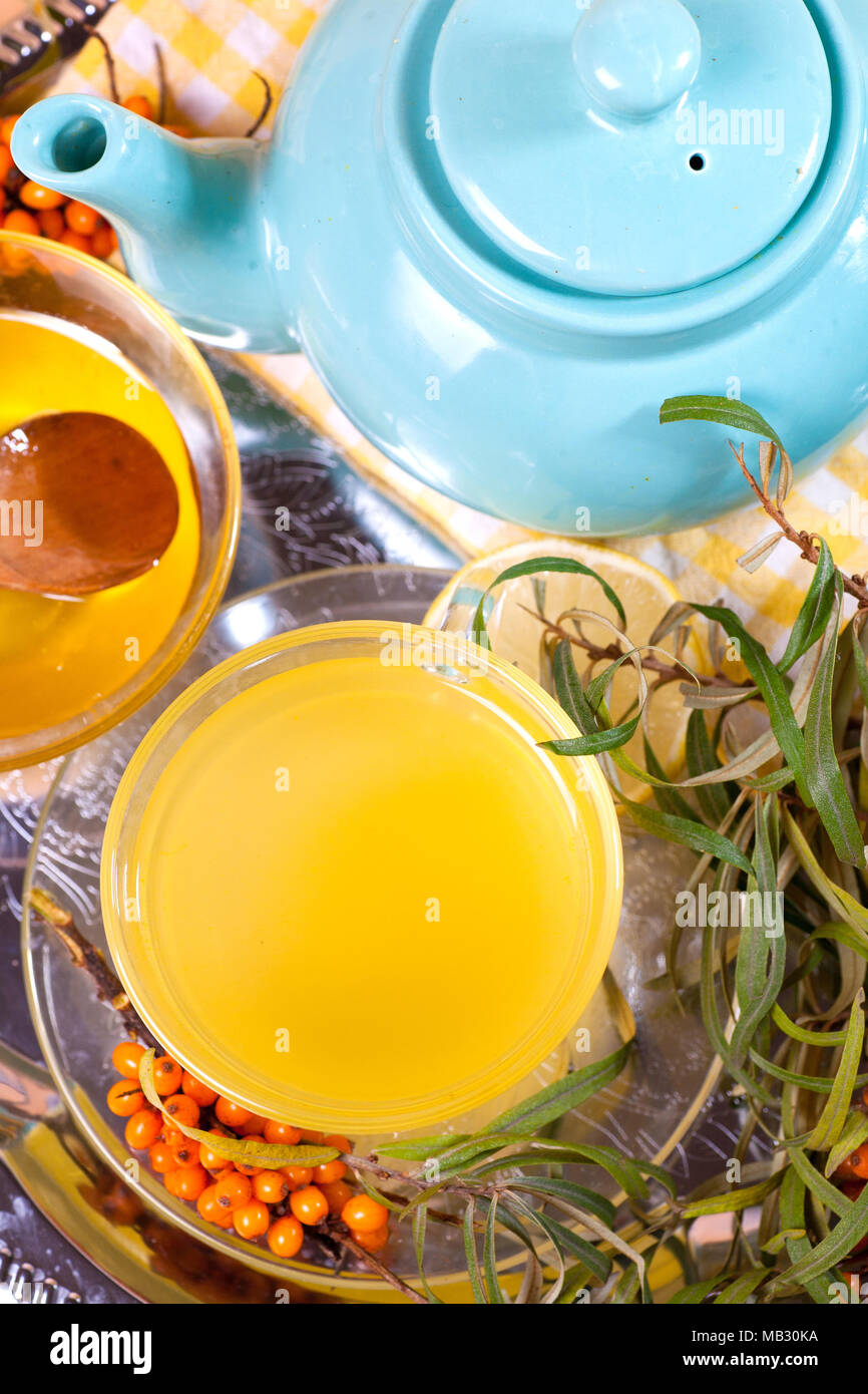 Sea buckthorn tea with a on white background Stock Photo - Alamy