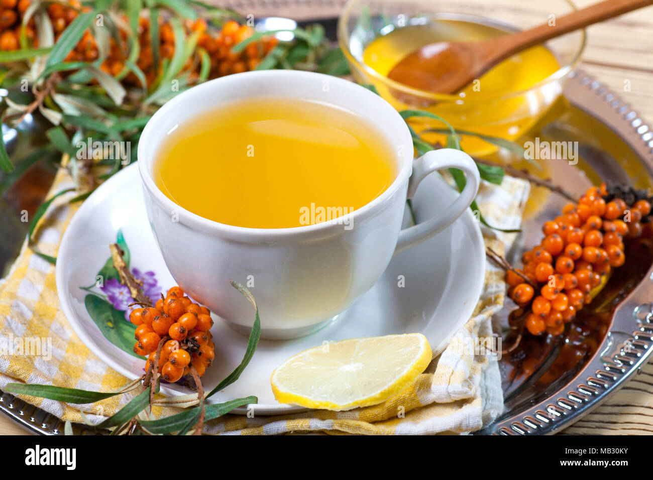 Sea buckthorn tea with a on white background Stock Photo - Alamy