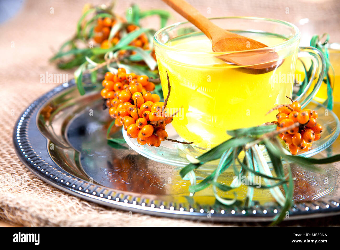 Sea buckthorn tea with a on white background Stock Photo - Alamy