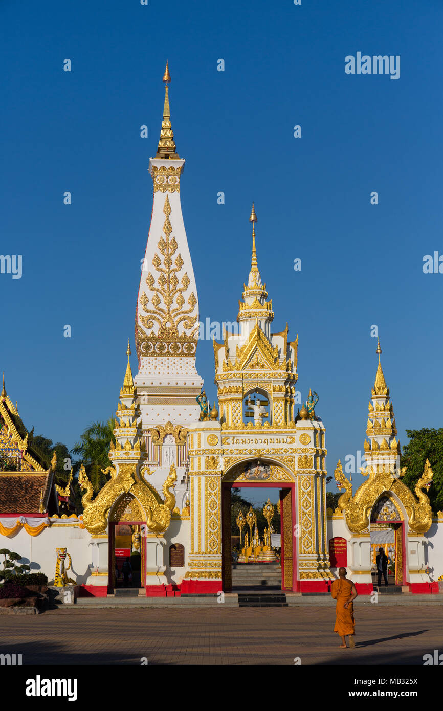 Monk in front of Chedi of Wat Phra That Phanom, temple complex in ...