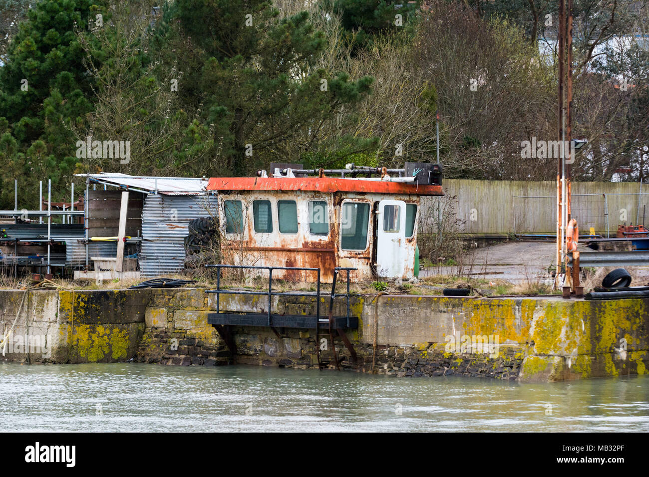 Run down abandoned building by the dock Stock Photo - Alamy