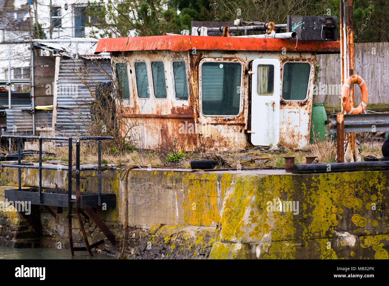 Run down abandoned building by the dock Stock Photo - Alamy