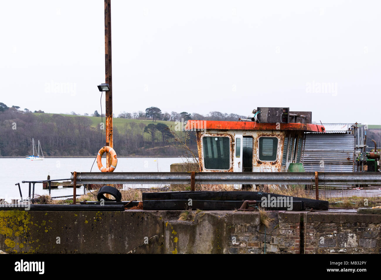 Run down abandoned building by the dock Stock Photo - Alamy