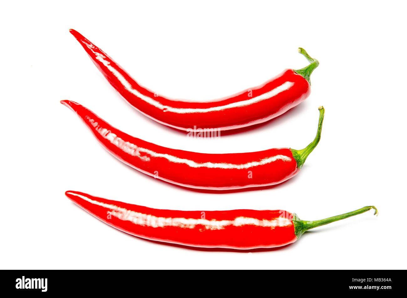 three chilies on a white background, isolated Stock Photo - Alamy