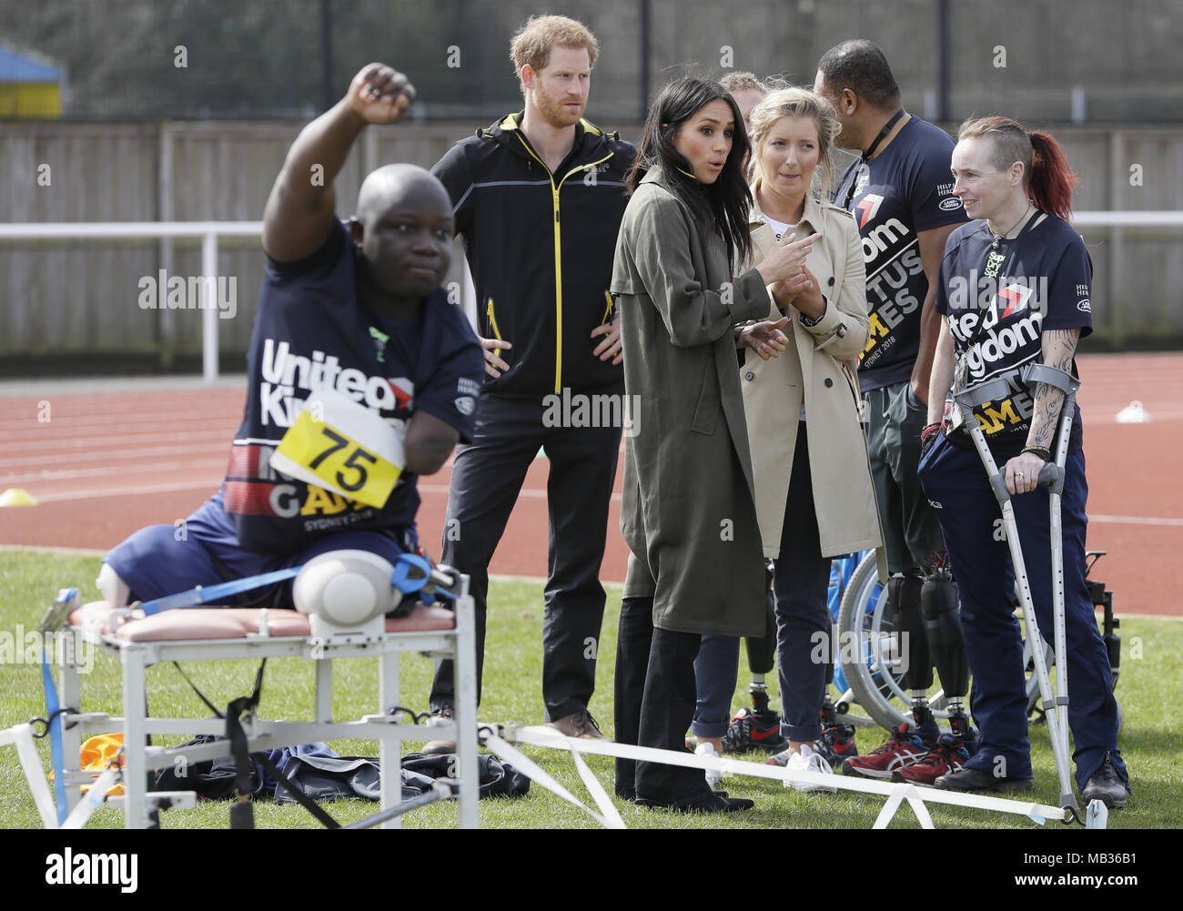 Prince Harry (back left), Meghan Markle and Jayne Kavanagh (centre ...