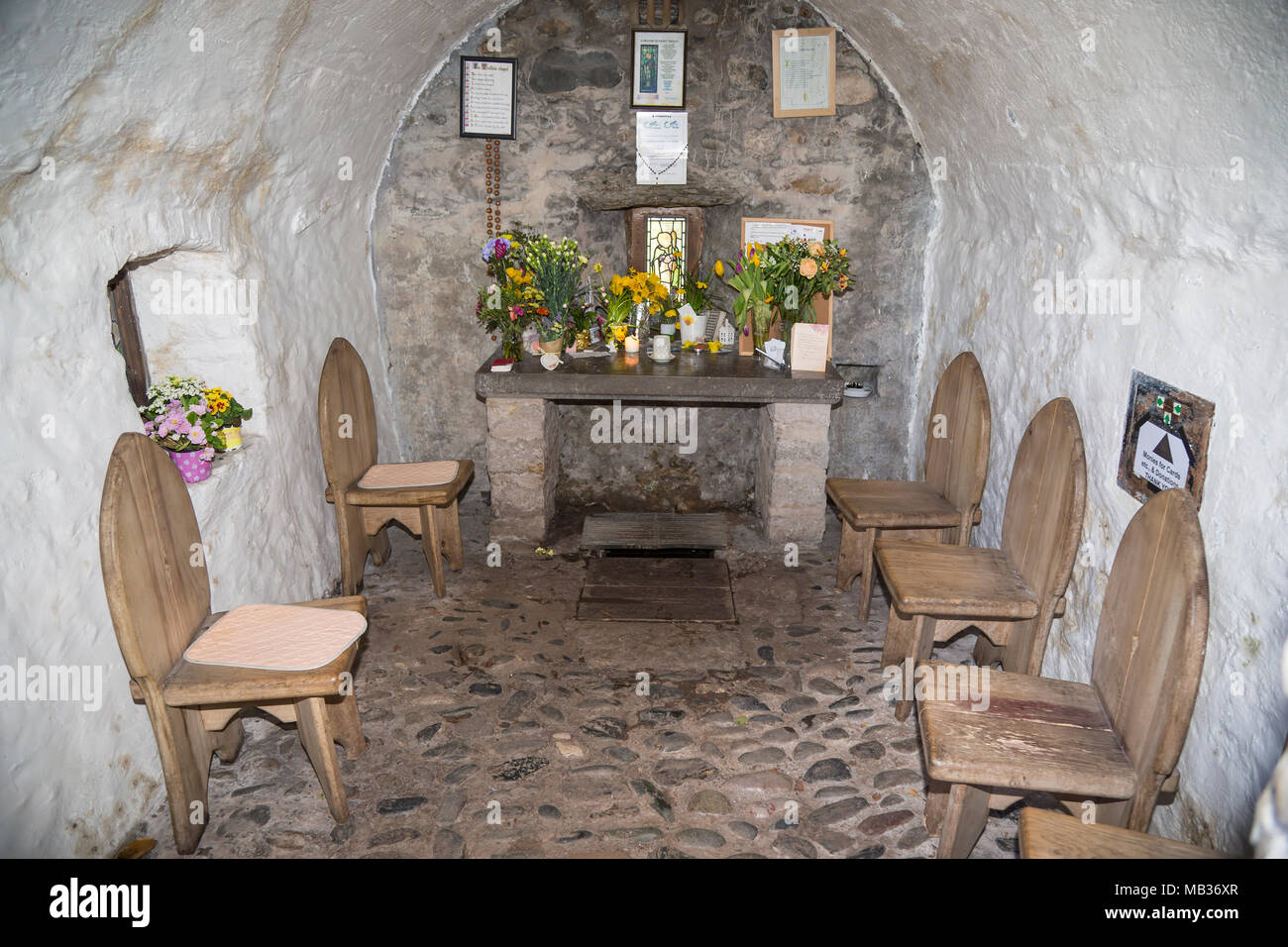 View inside the chapel of Saint Trillo, the smallest chapel in Britain ...