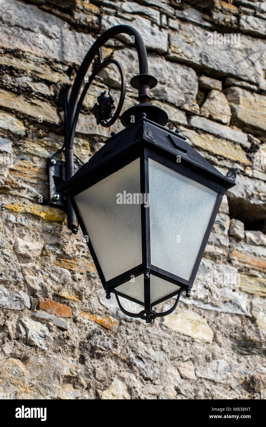 street lamp against a stone wall. Close up Stock Photo - Alamy