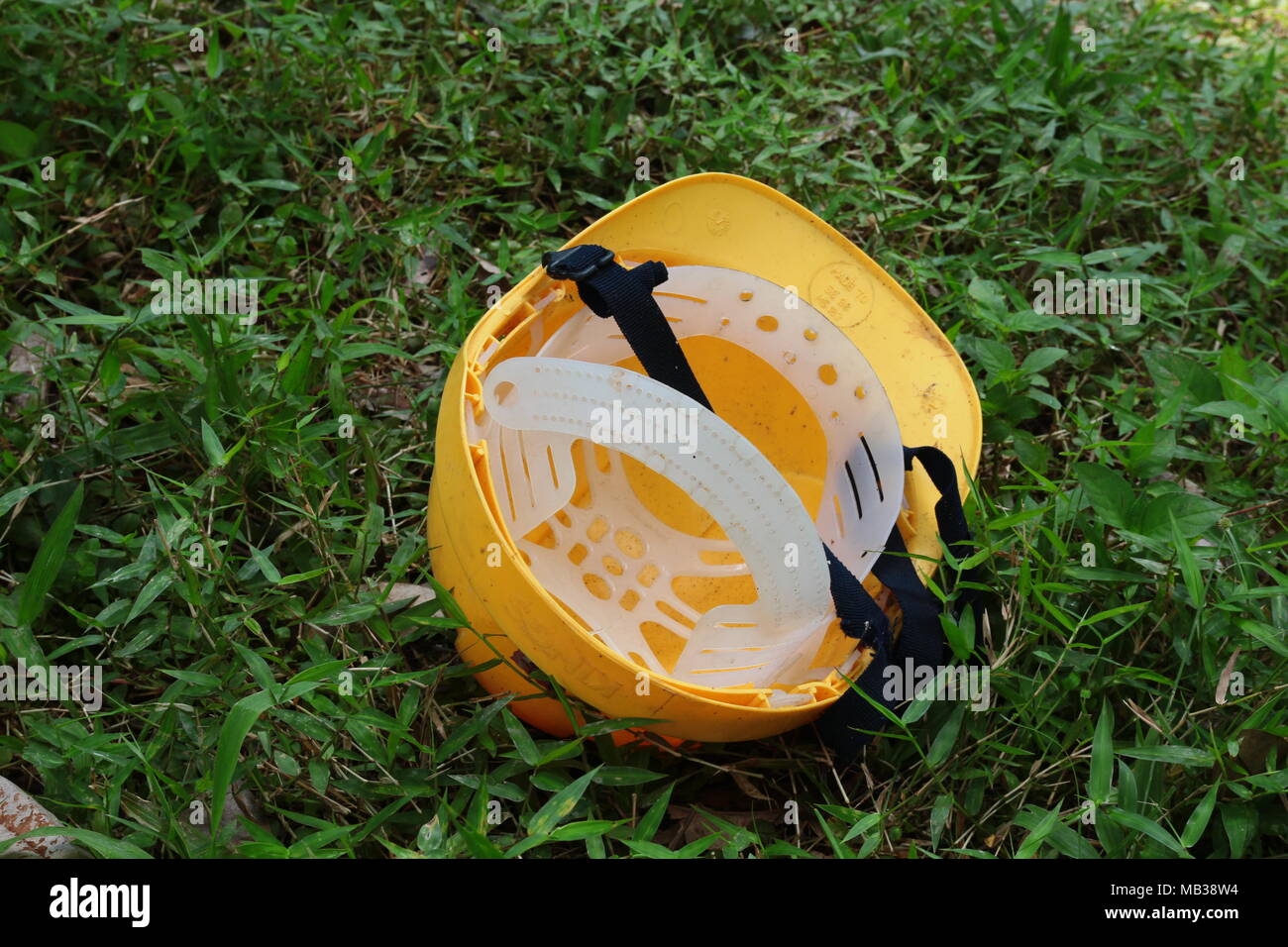 Safety helmet in yellow colour Stock Photo - Alamy