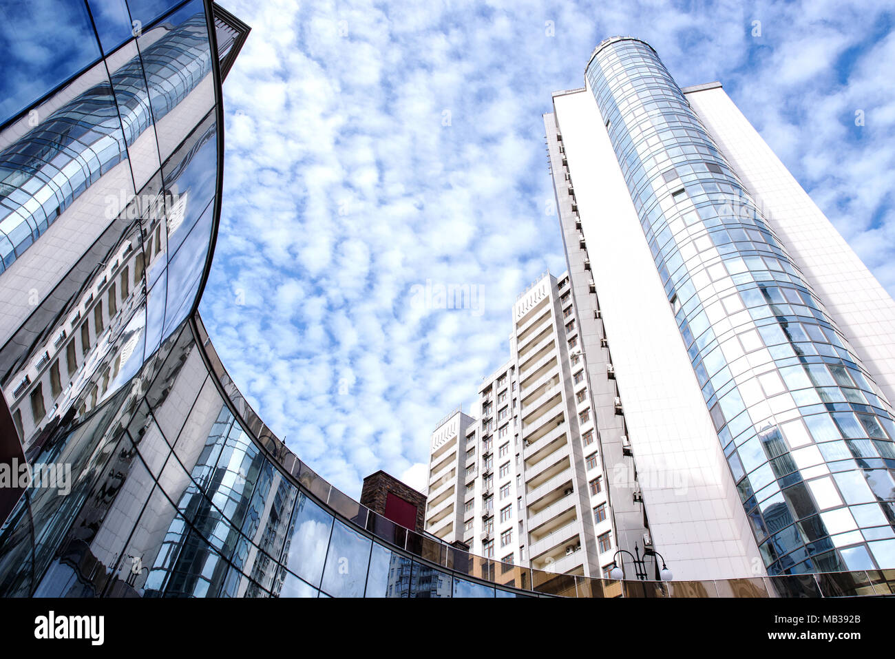 Daytime and nighttime photos at new successful district. High buildings ...