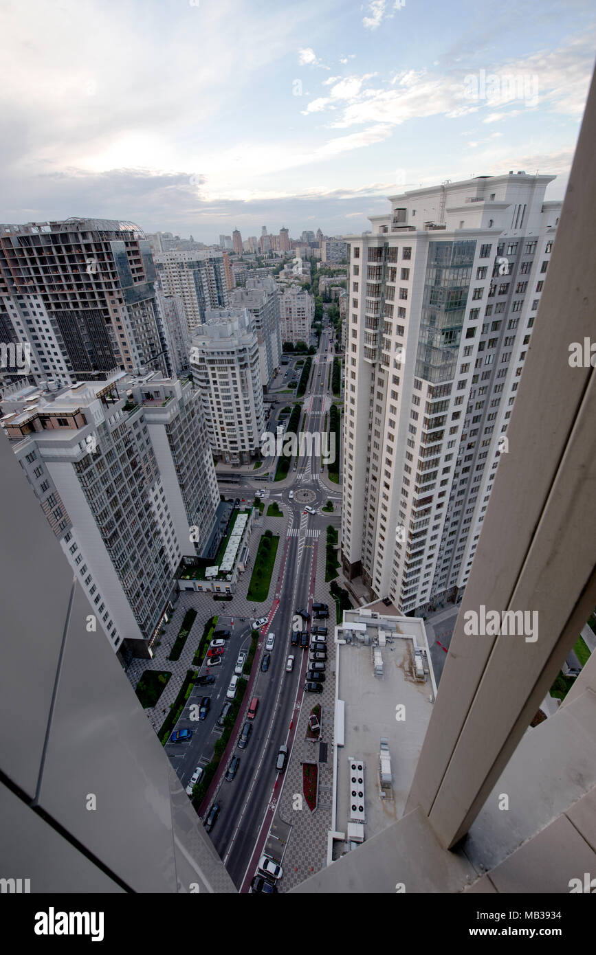 Daytime and nighttime photos at new successful district. High buildings ...