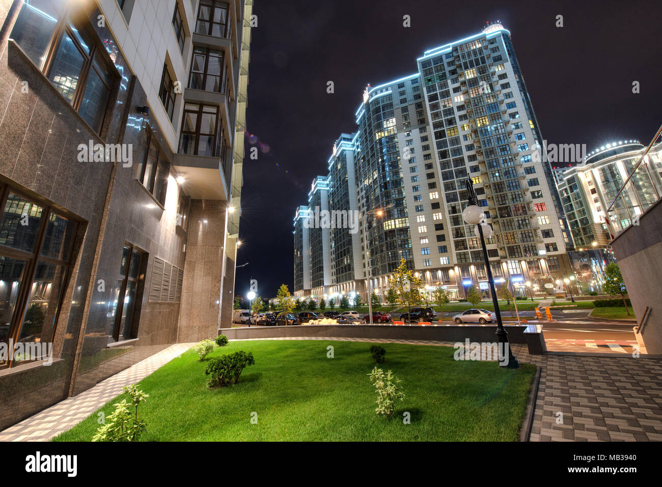 Daytime and nighttime photos at new successful district. High buildings ...